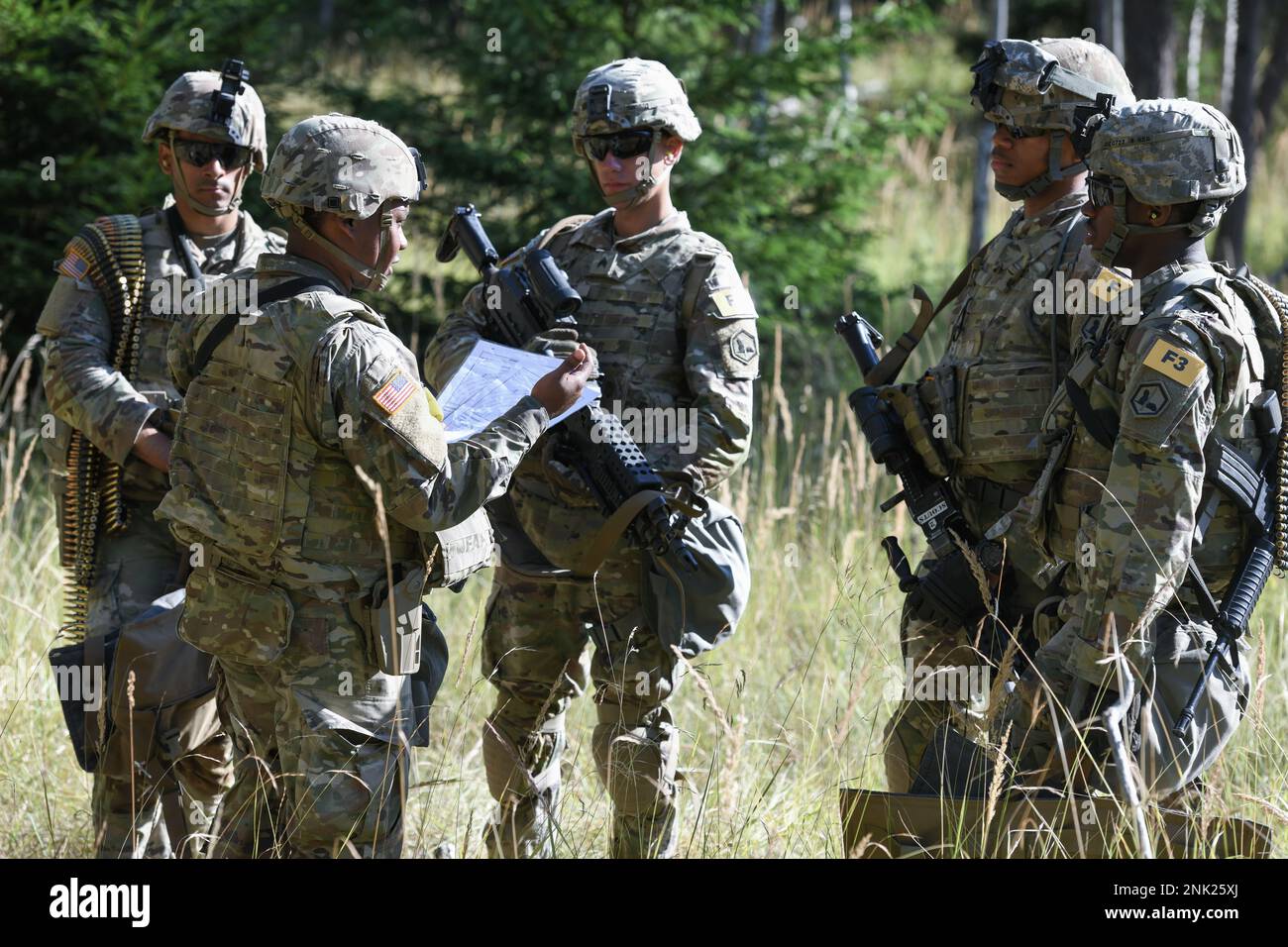 U.S. Army Staff Sgt. Chaven Marshall, second from left, assigned to ...