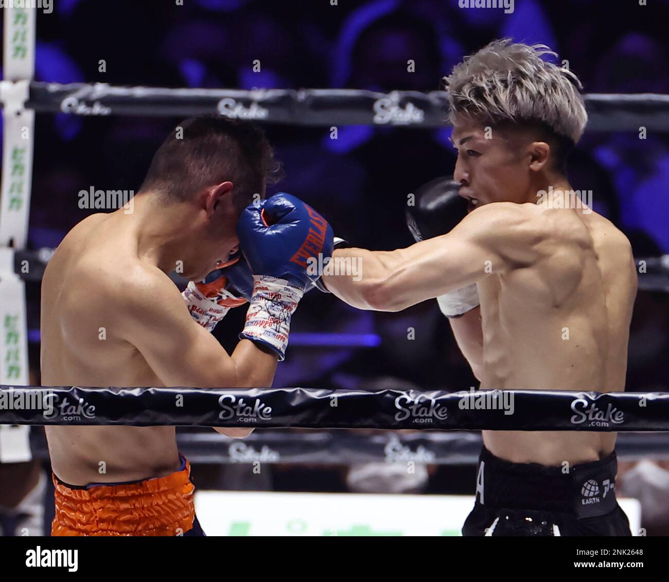 Naoya Inoue of Japan strikes a punch in the 1st round during the ...