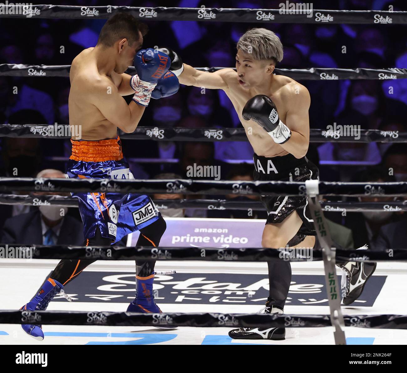 Naoya Inoue of Japan strikes a punch in the 1st round during the ...
