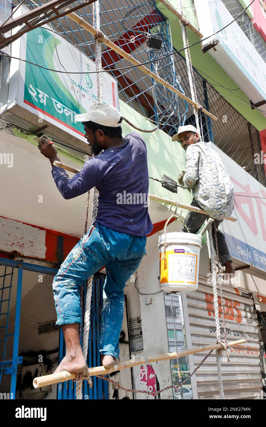 Dhaka, Bangladesh - February 23, 2023: Construction workers are hanging ...