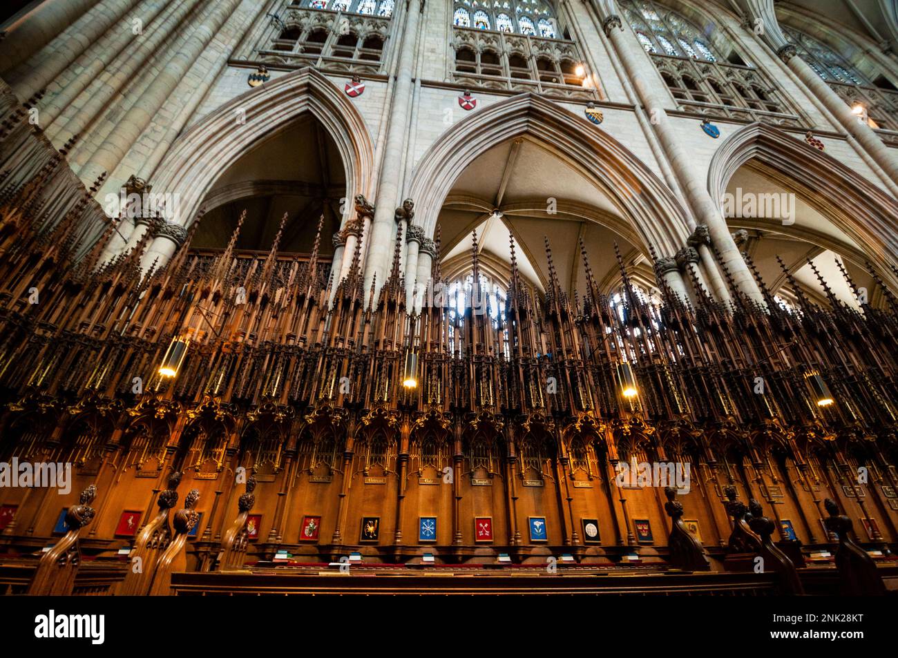 Gothic pointed arches tower over elaborately wood carved prebendary ...