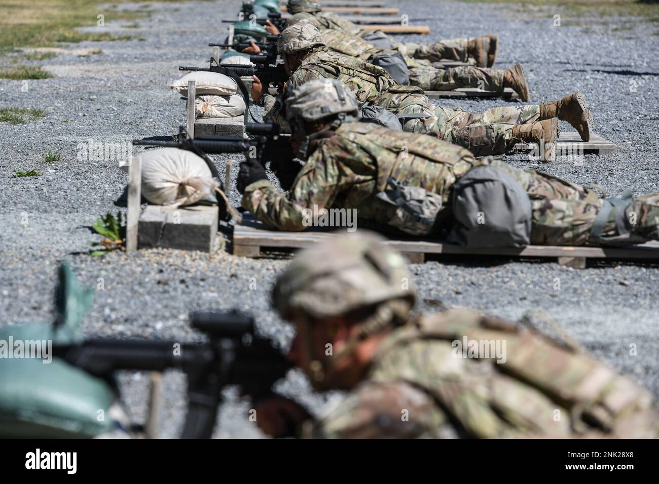 U.S. Soldiers assigned to 66th Military Intelligence Brigade fire M4 ...