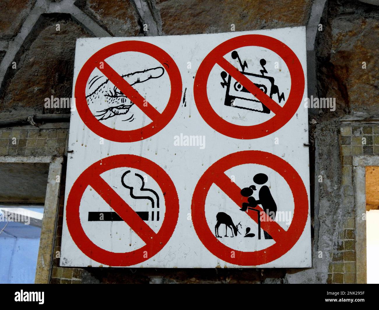 An informative sign not to smoke, touching the glass is prohibited ...