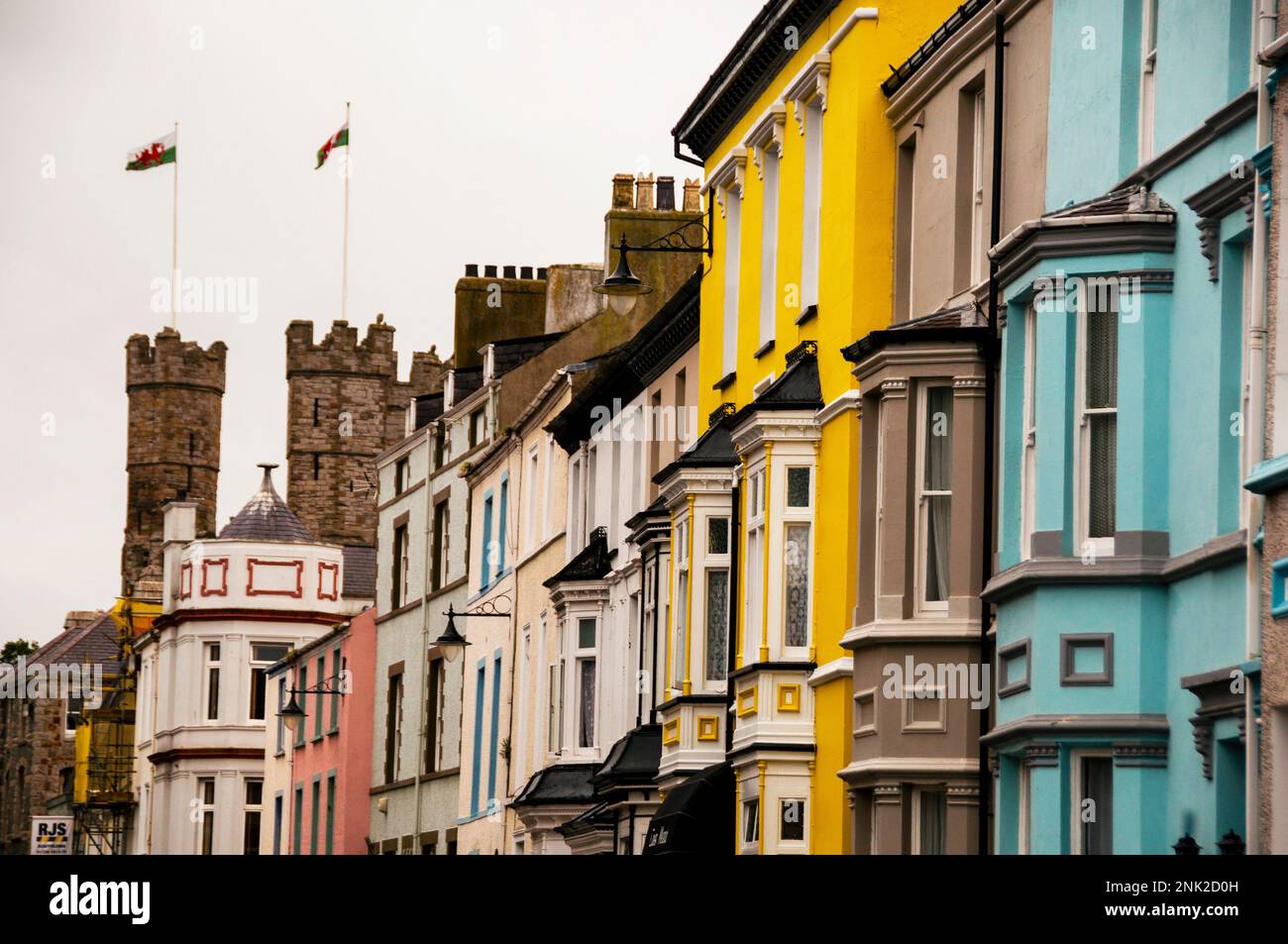 Polygonal turrets of Caernarfon Castle and Victorian terrace houses ...