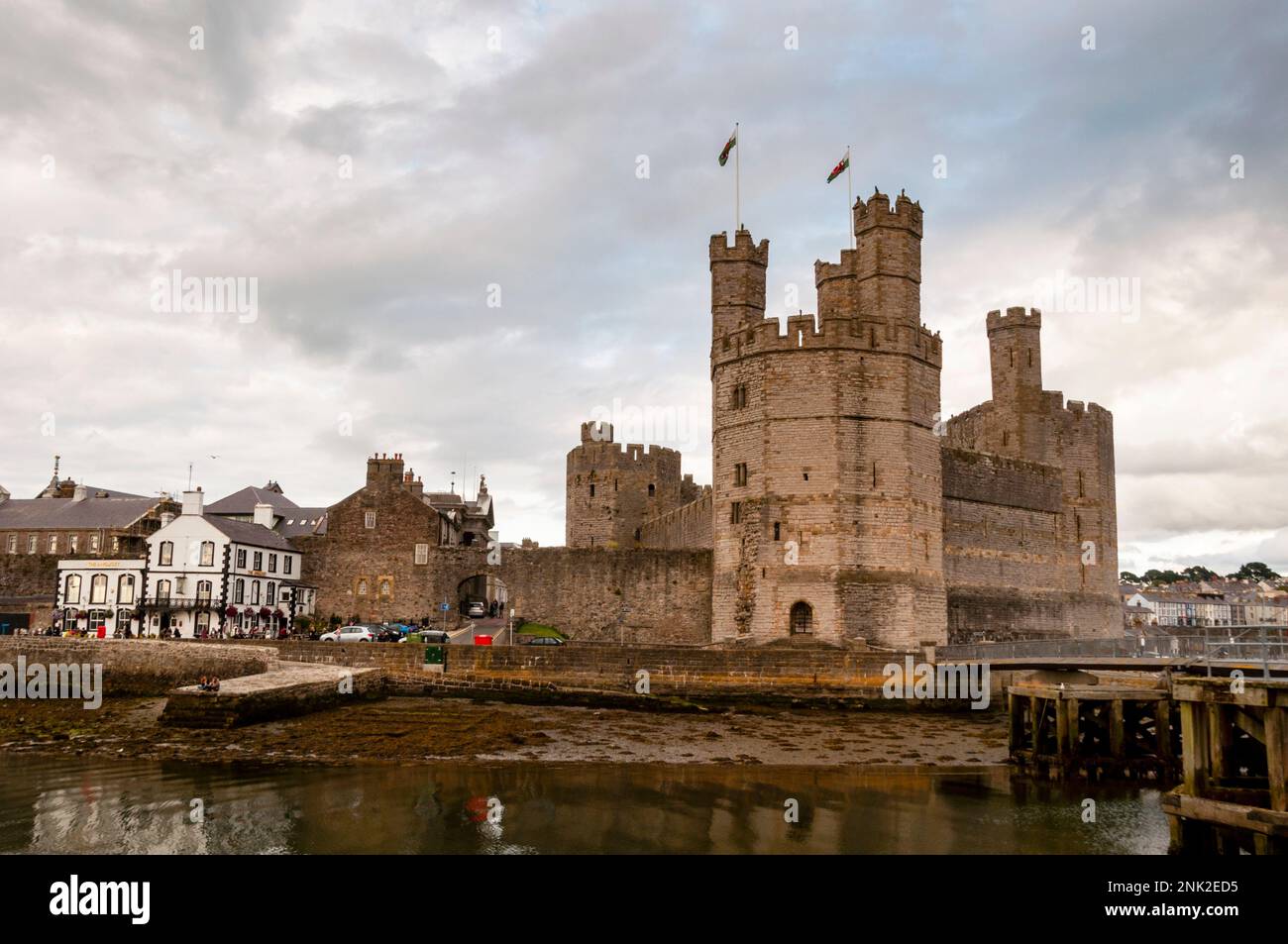 Castle, town walls and quay of the dramatic Edwardian style Caernarfon ...