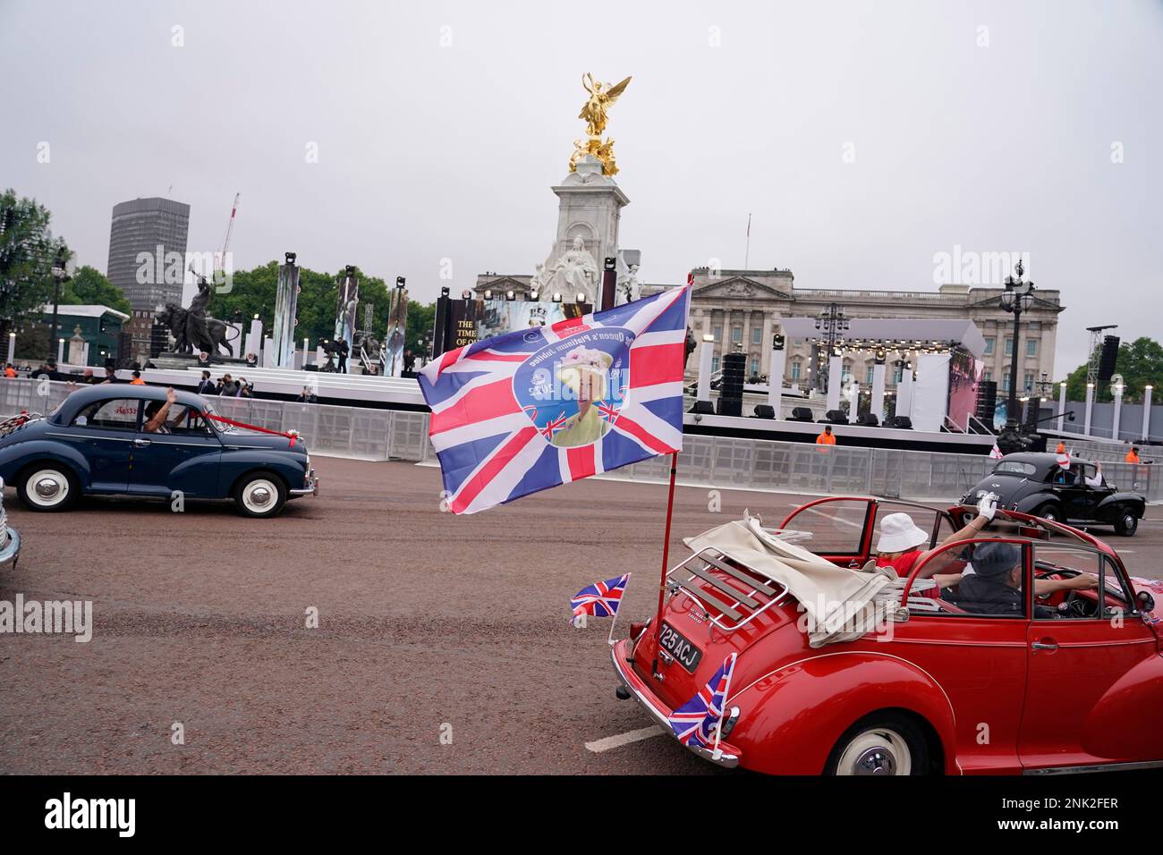Drivers with cars parade during the Platinum Jubilee Pageant outside ...