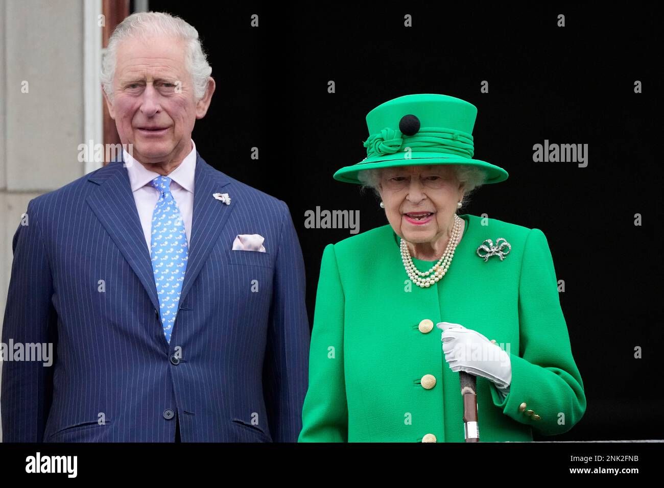Queen Elizabeth II stands with his son Prince Charles on the balcony ...