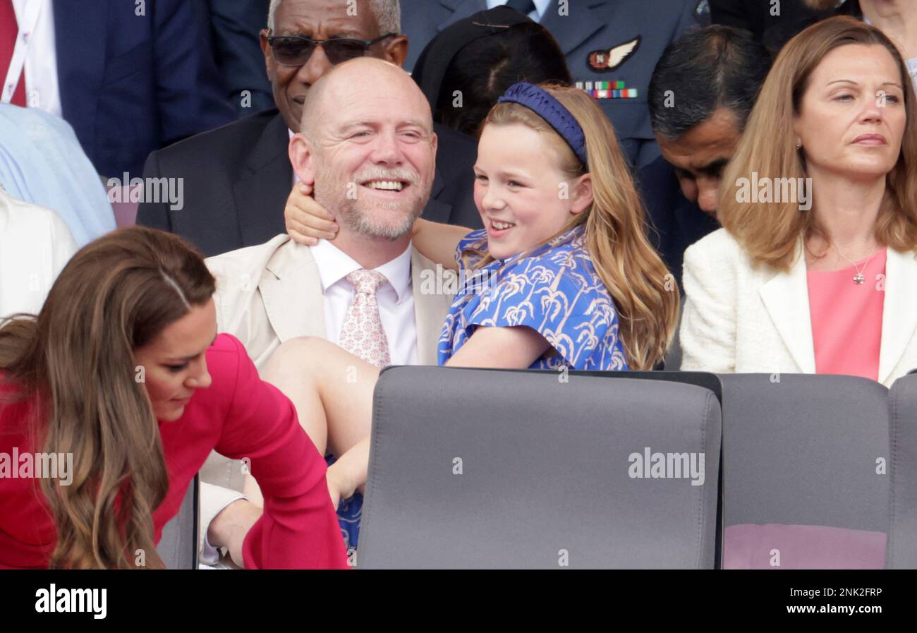 Mike Tindall, centre left, reacts with his daughter Mia Tindall as they ...