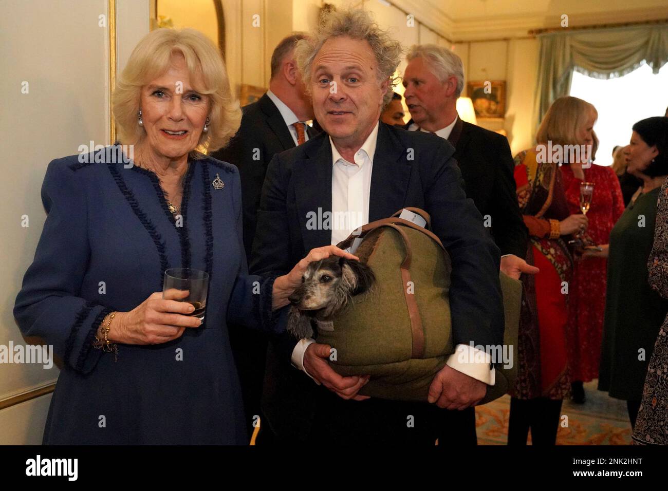 Camilla, the Queen Consort meets author Charlie Mackesy and his dog ...