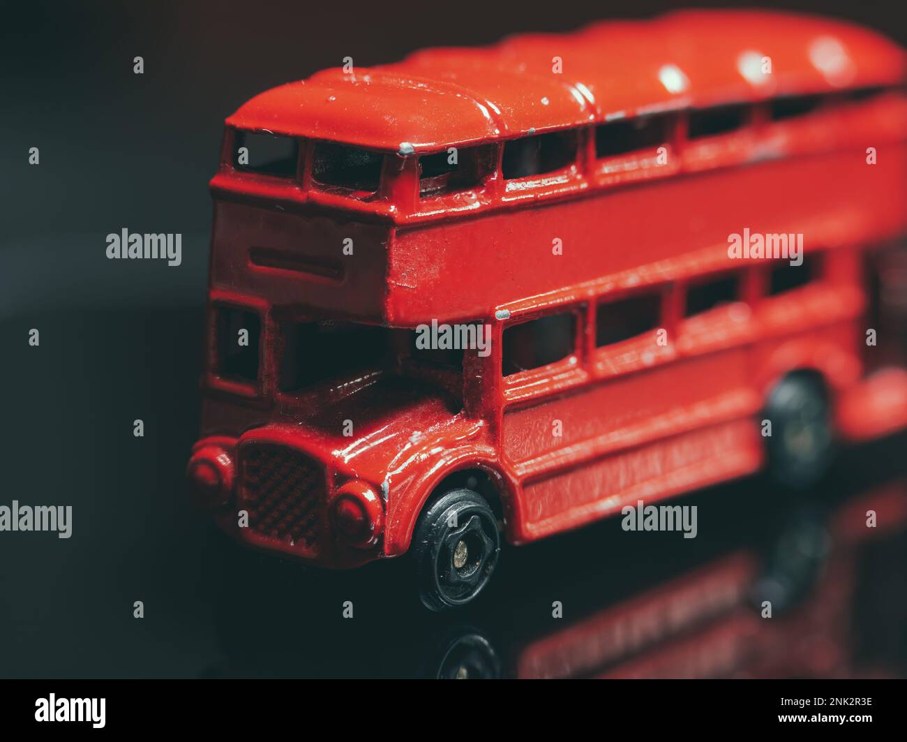Detail with a double decker red bus toy Stock Photo - Alamy