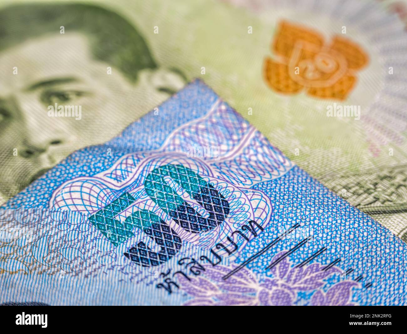 Macro detail with a 50 Thai Baht banknote. the baht is the official ...