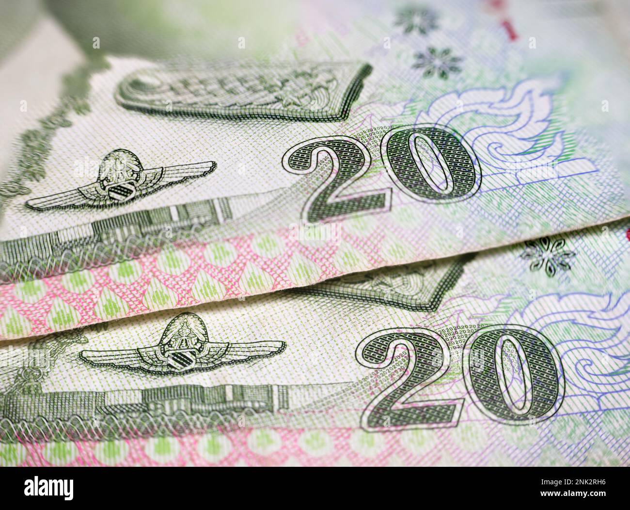 Macro detail with a 20 Thai Baht banknote. the baht is the official ...