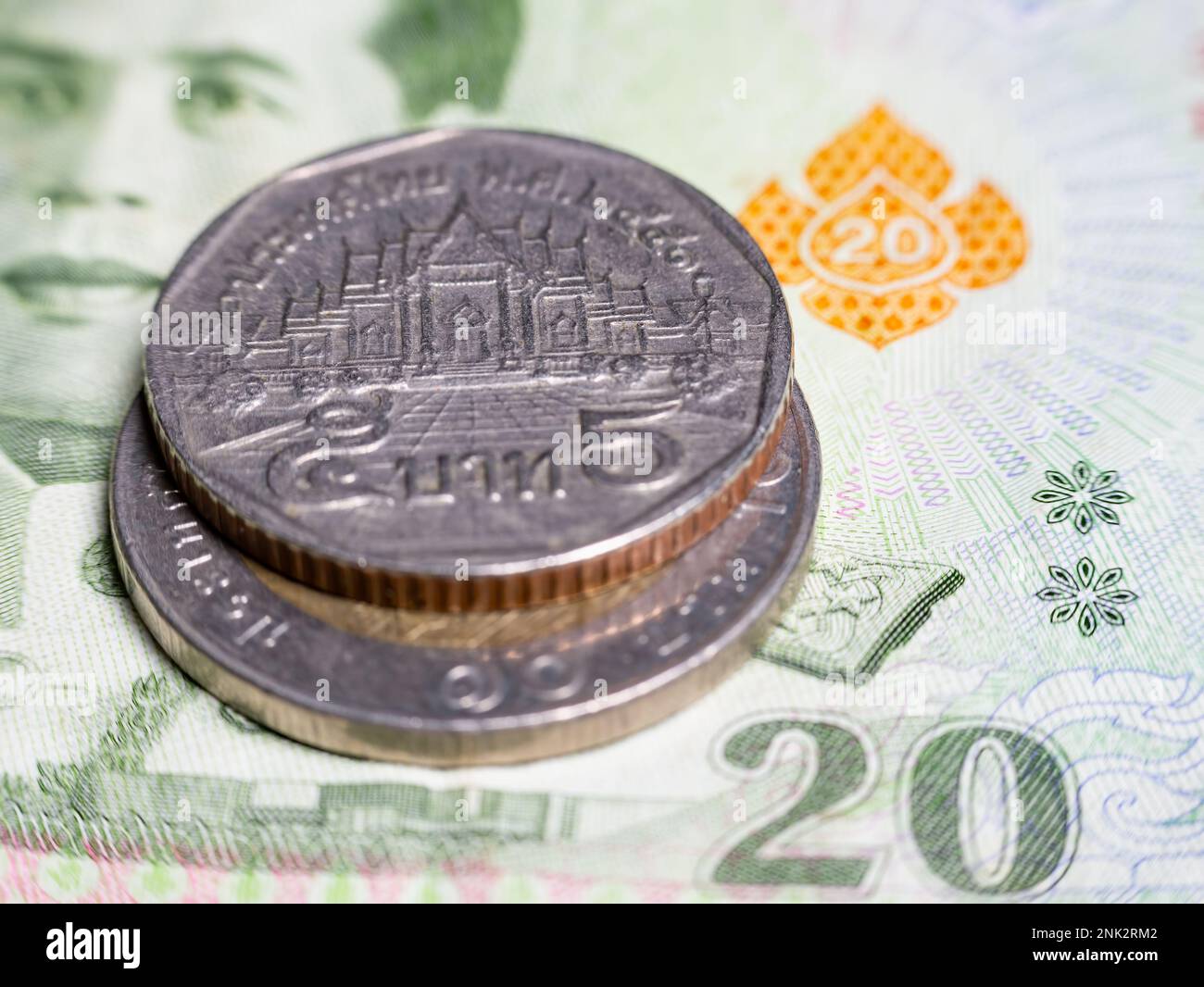 Macro detail with a 5 Thai Baht coin. the baht is the official currency ...