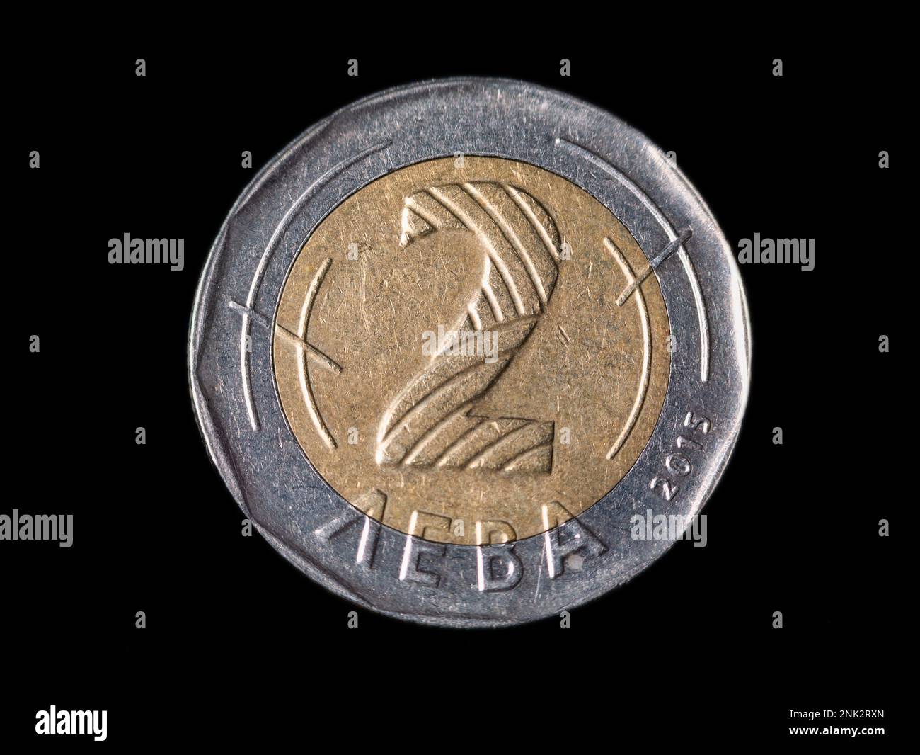Macro detail with Bulgarian 2 Lev coin on black background. The Lev is ...