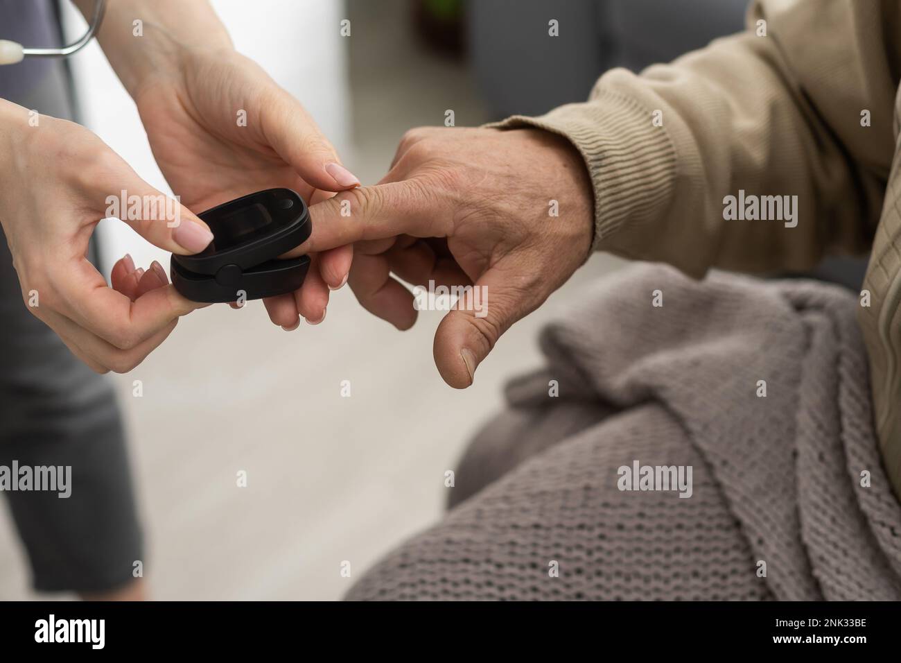 Nurse use pulse oximeter to check patient's oxygen in home , Home ...