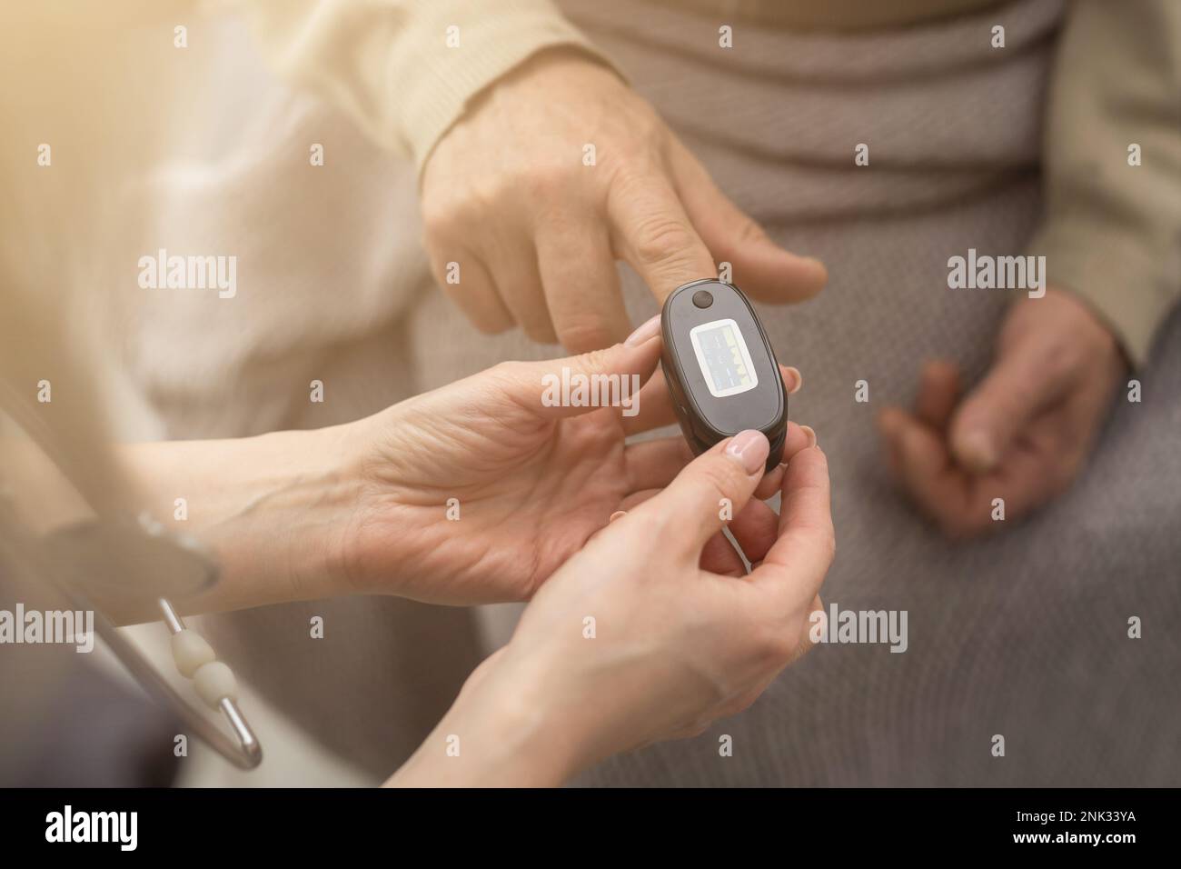elderly man and nurse measuring pulse oximeter Stock Photo - Alamy