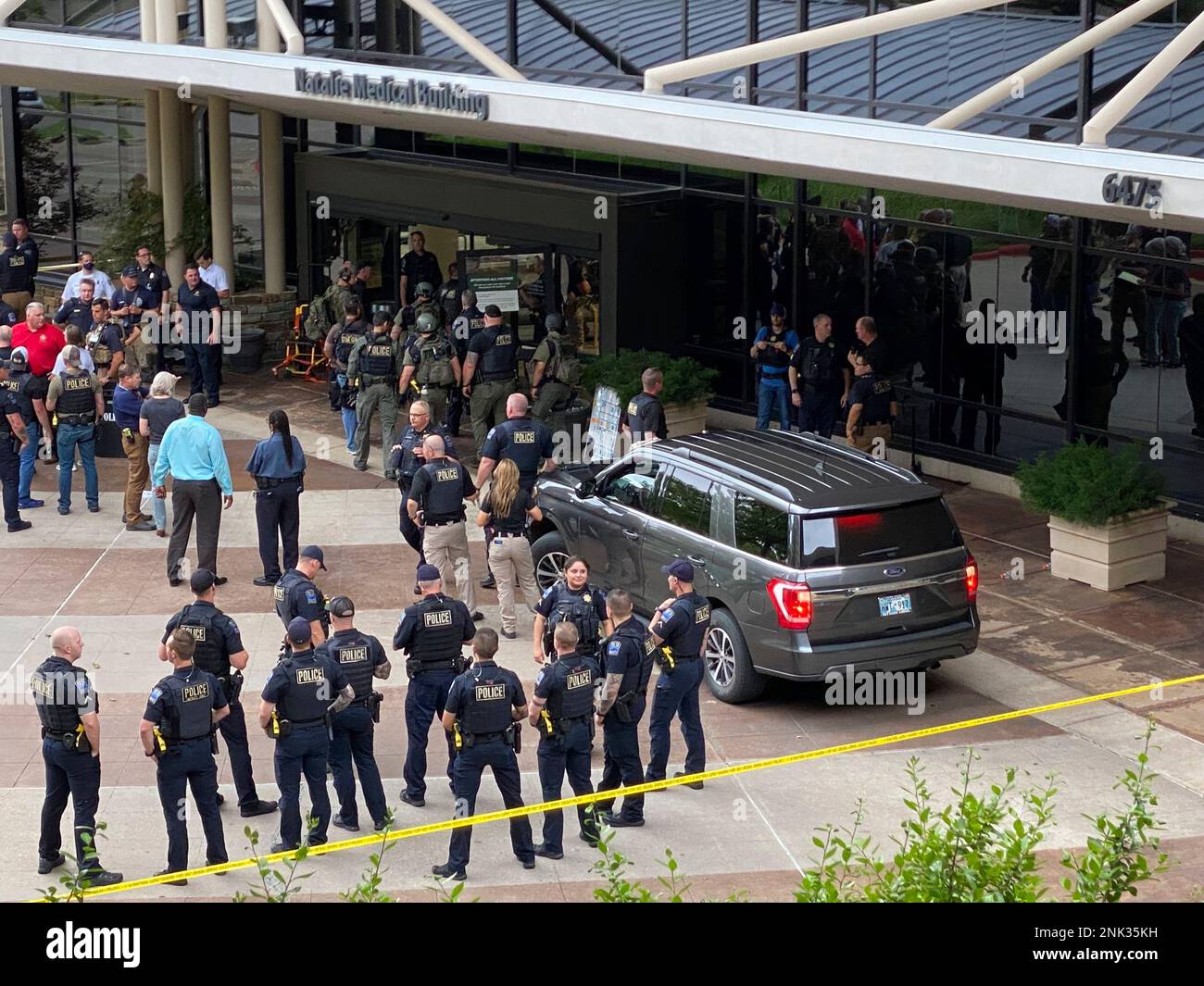 Emergency personnel respond to a shooting at the Natalie Medical ...