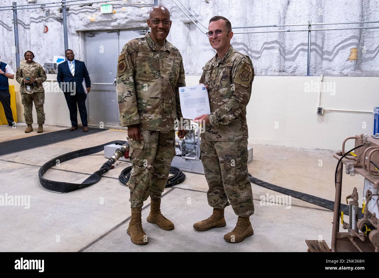 U.S. Air Force Chief of Staff Gen. CQ Brown, Jr., left, presents U.S ...