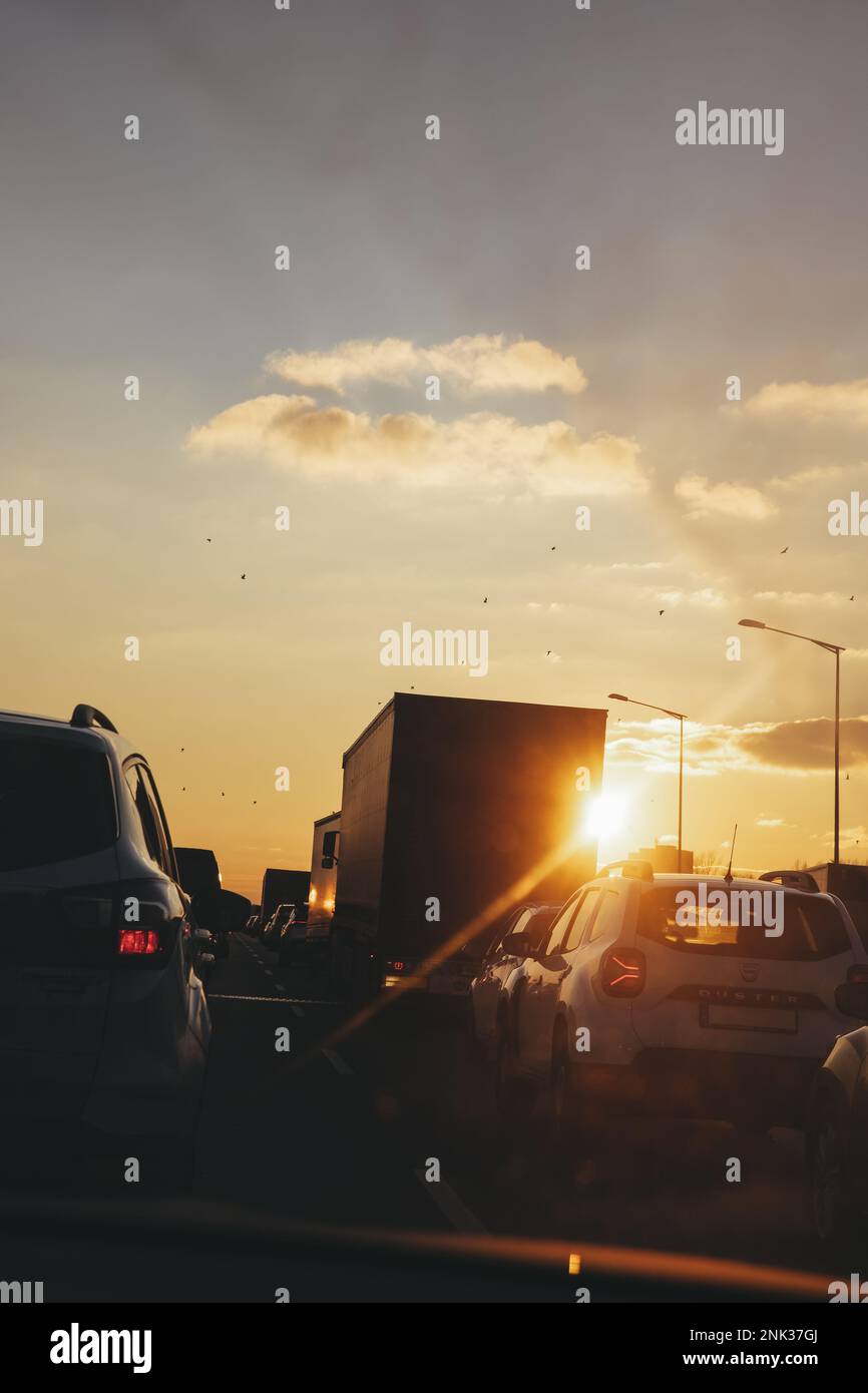 Sunset in a traffic jam Stock Photo - Alamy