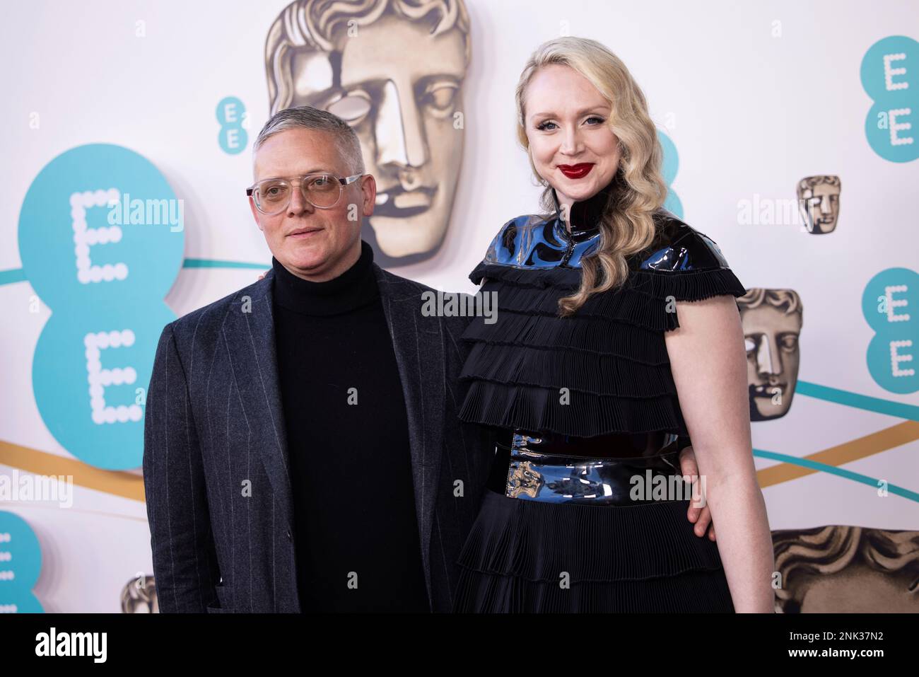 Giles Deacon and Gwendoline Christie pose for photographers upon ...
