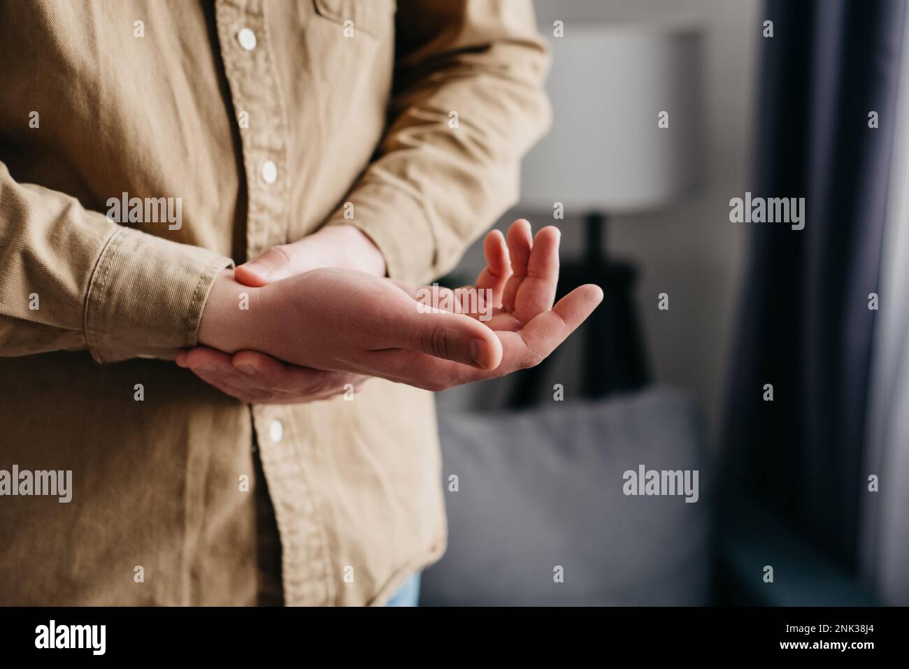 Rheumatoid arthritis concept. Close up of male suffer from numbing pain ...