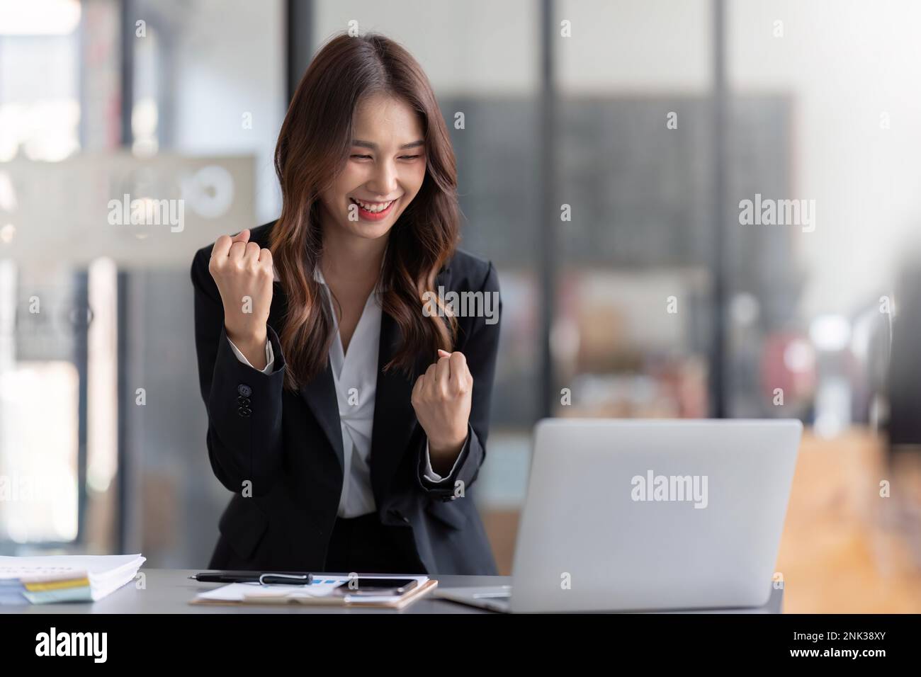Happy female office employee read pleasant e-mail on laptop, get career ...