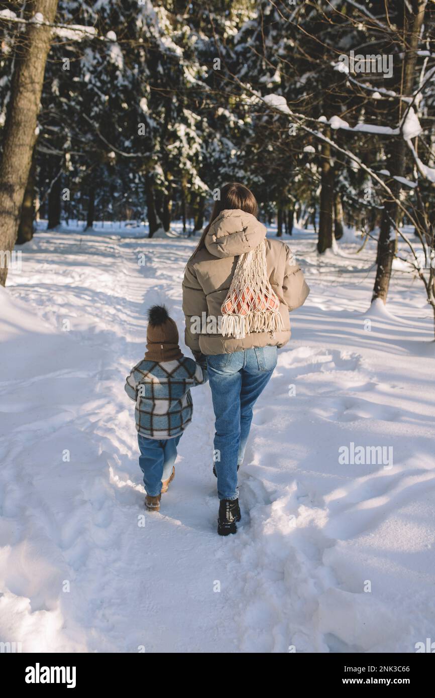 Mother and son winter stroll Stock Photo - Alamy