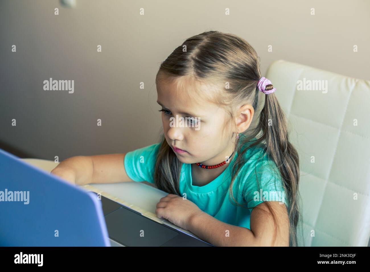 Little cute girl uses laptop to have video call Stock Photo - Alamy