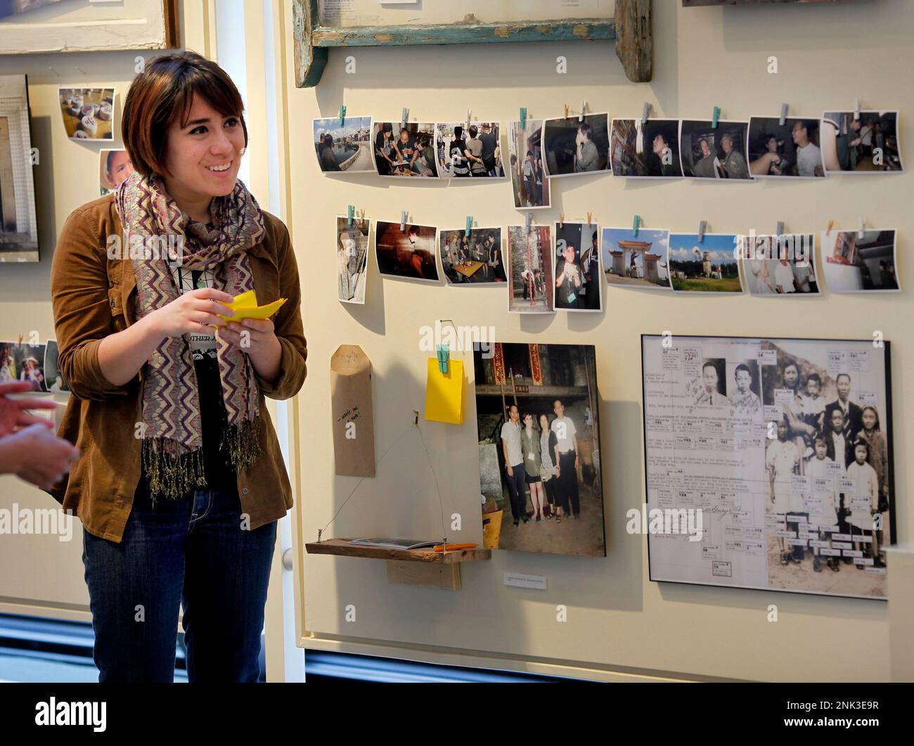 Amy Koehler reads some notes left by visitors of her exhibit showing ...