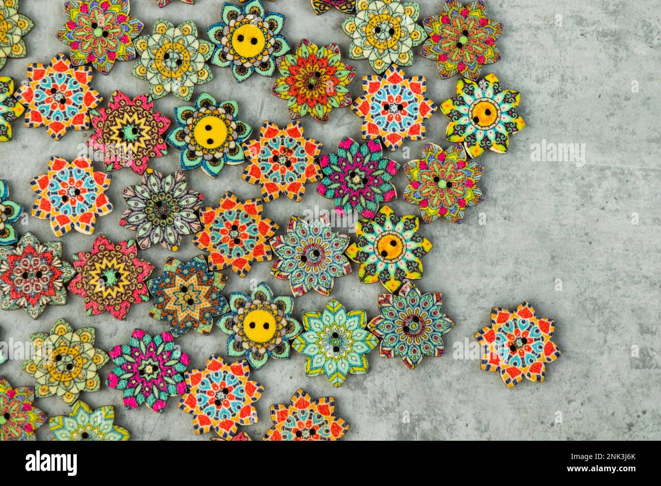 Colorful ornamental button on the gray background, backdrop Stock Photo ...