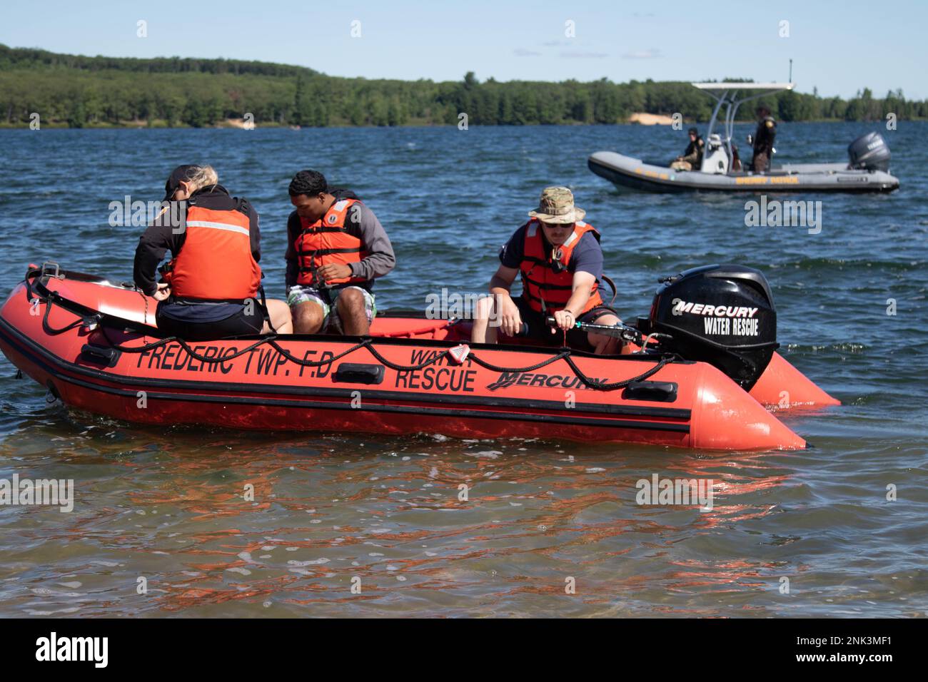 Firefighters and emergency medical technician rescue swimmers from the ...