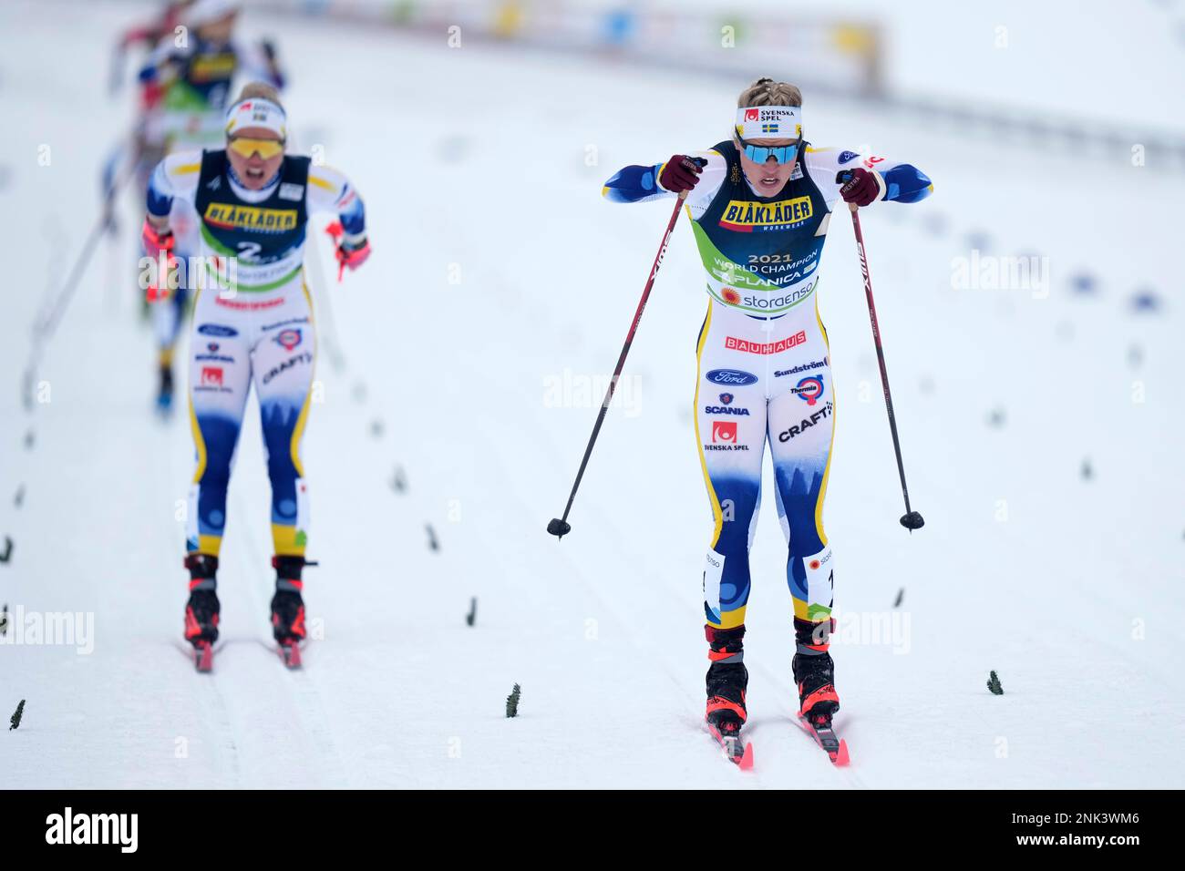 Sweden's Jonna Sundling, right, crosses the finish line ahead of Sweden ...