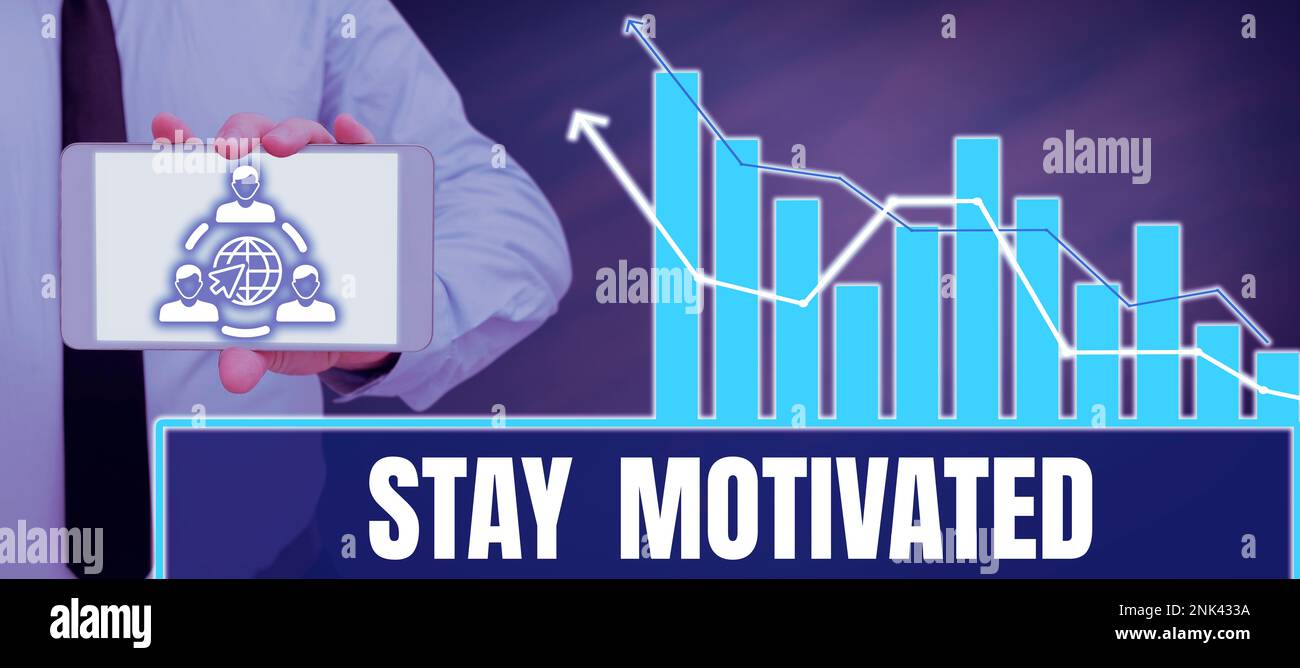 Hand writing sign Stay Motivated. Word for Reward yourself every time ...