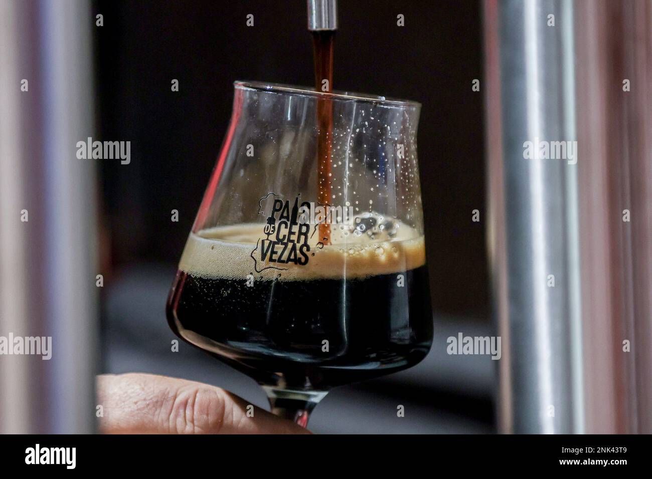A black draft beer poured in a crystal glass during the Gran Festival ...