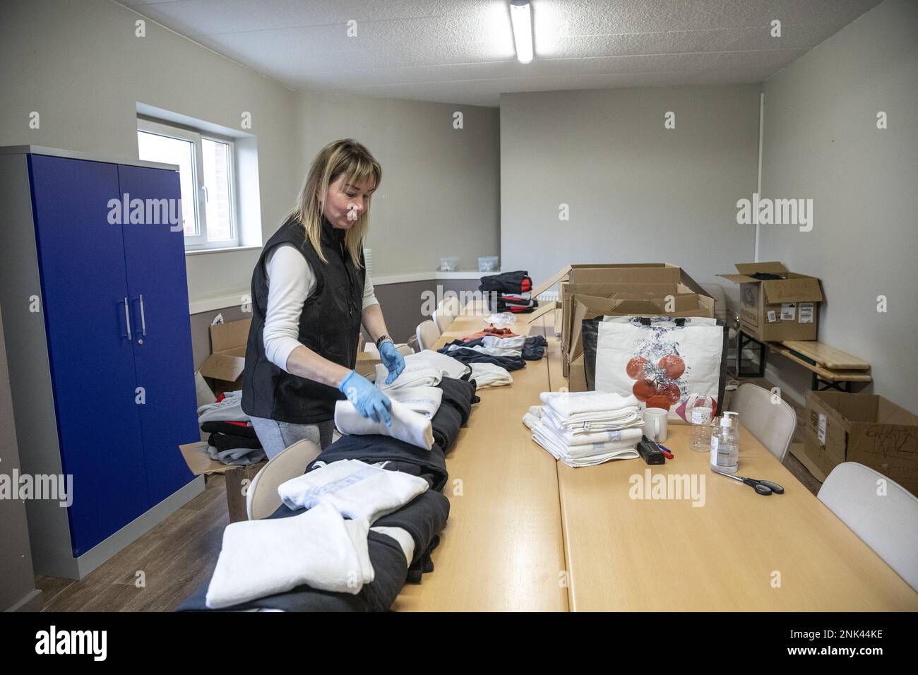 Illustration shows sheets and blankets prepared in a former rest home ...