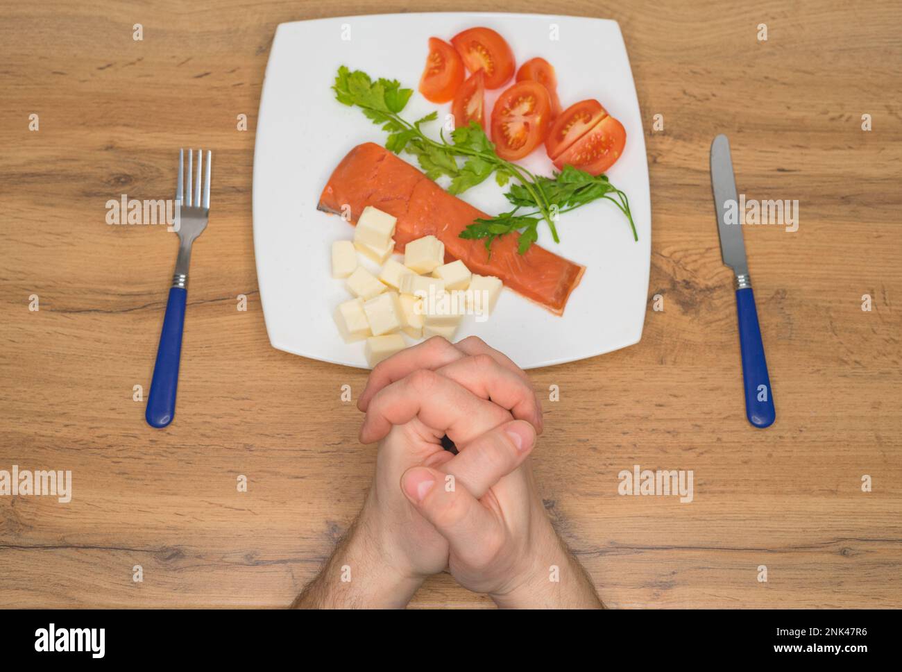Man praying before eating his lunch. Thanking God for meal. Keto diet ...