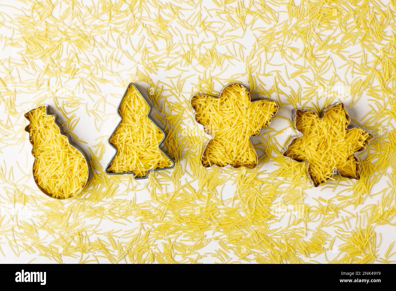 Creative christmas shapes shapes with pasta inside, on white background ...
