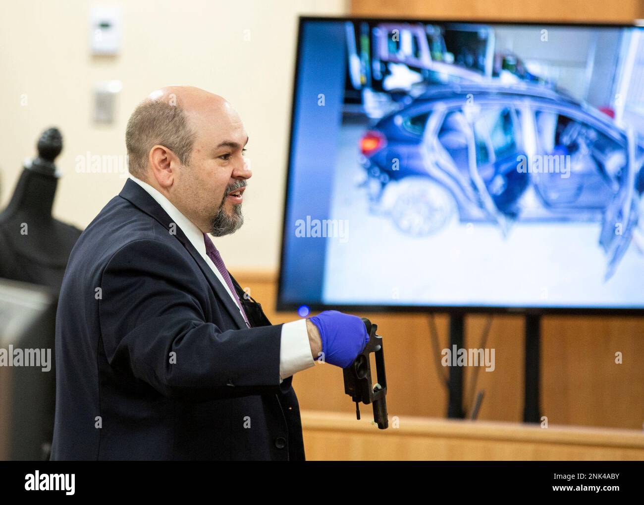 Senior Assistant Attorney General Benjamin Agati delivers the ...