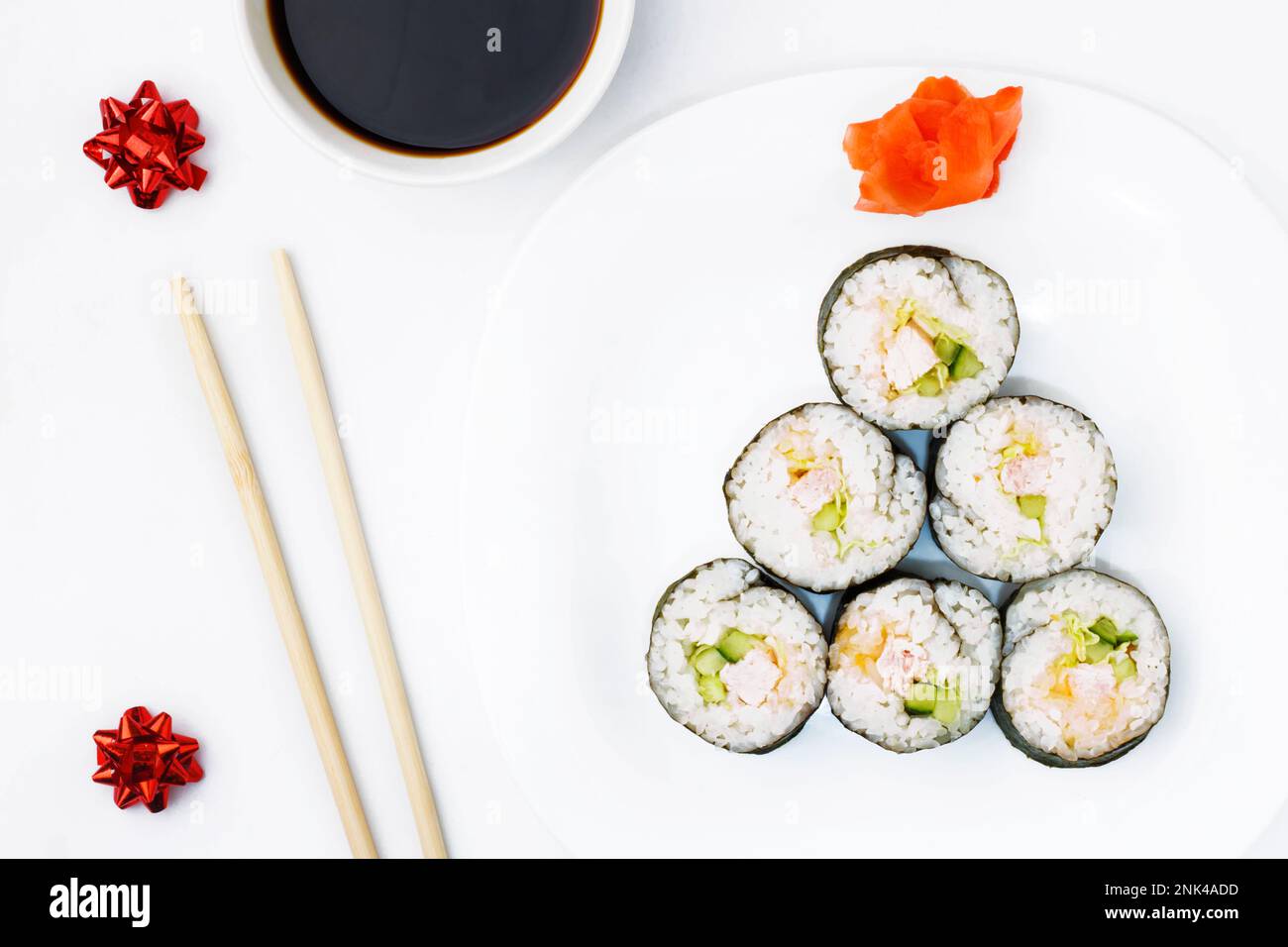 Funny edible Christmas tree, from sushi rolls, on white background ...