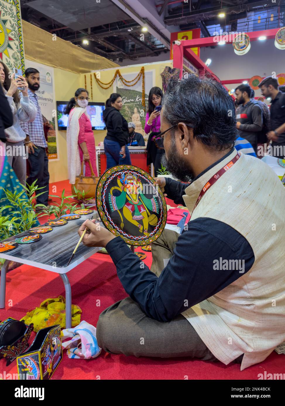 New Delhi, India - November 2022: An male artist painting on canvas ...