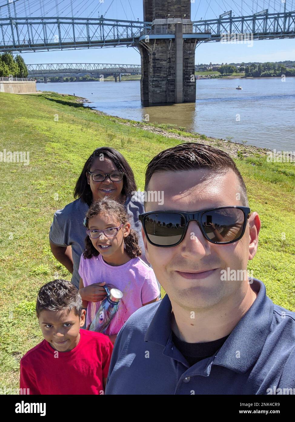 Master Sgt. Andrew Davis poses with his wife, daughter and son while ...