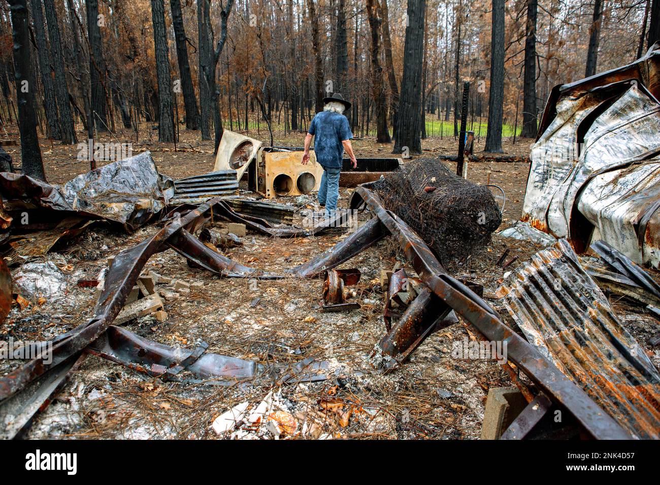 Art Castile at the charred remains of his home on Tuesday, March 5 ...