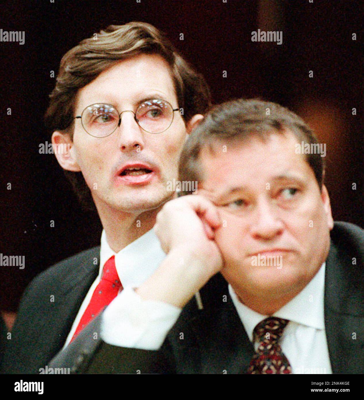 Fred Tokars left and his attorney Jim Berry listen to arguements during ...