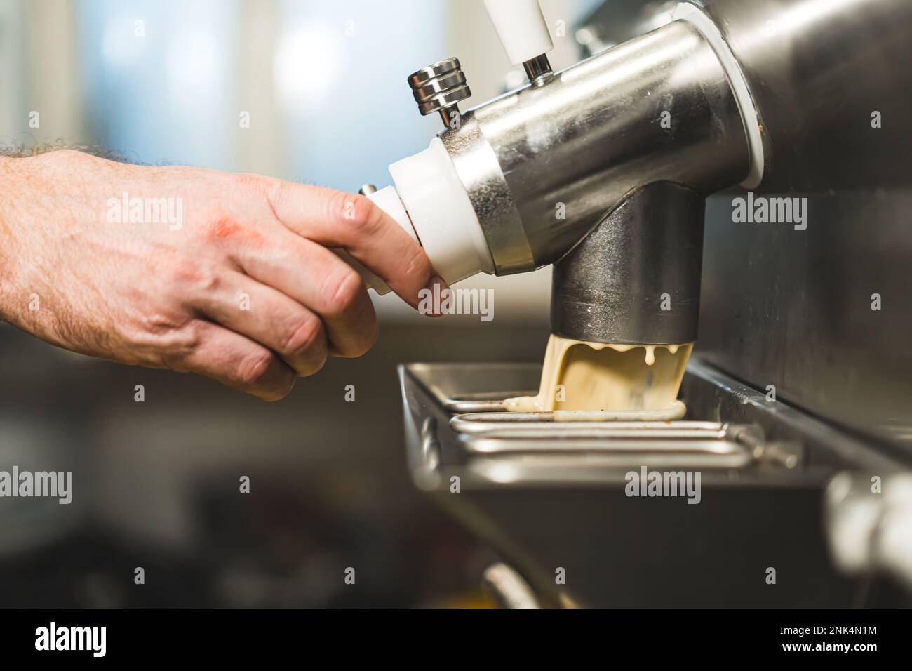 Pouring ice cream formula from pasteurizer. High quality photo Stock ...