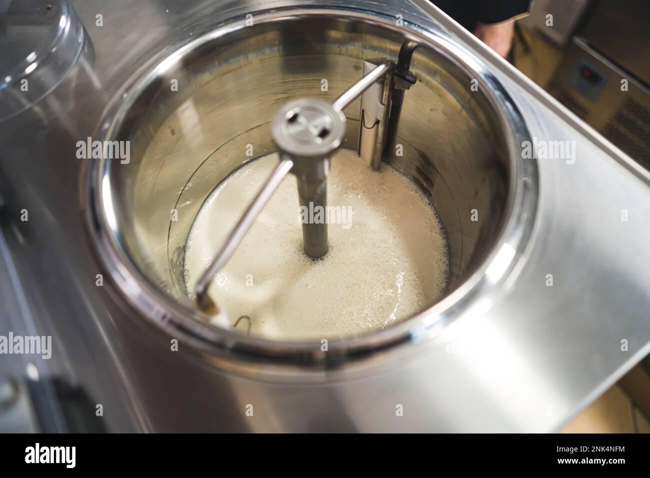 Dairy products in pasteurization machine for ice cream. High quality ...