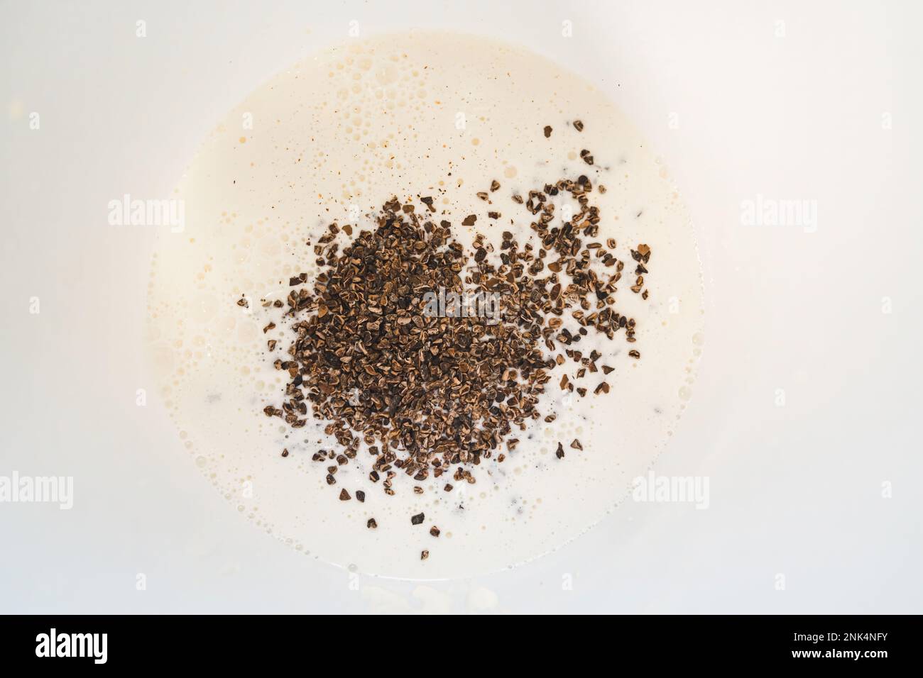 Mixing dry and liquid ingredients for chocolate ice cream top view ...