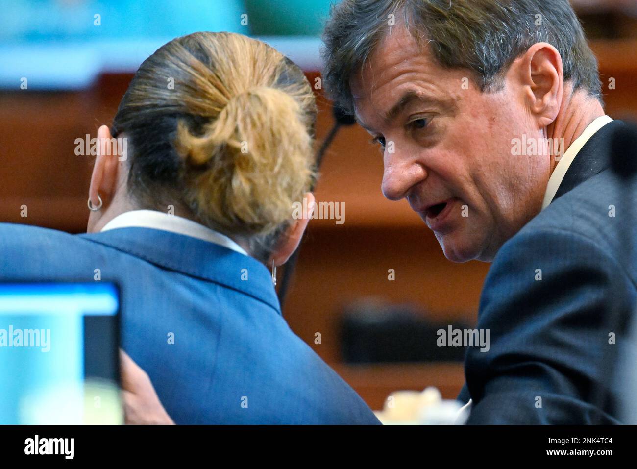 Actor Johnny Depp talks to his attorney Ben Chew in the courtroom at ...