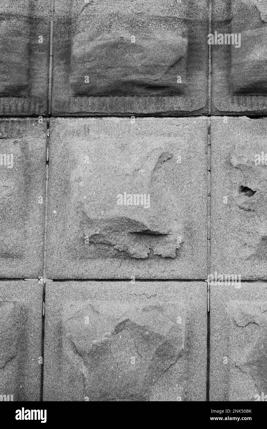 Decorative limestone block wall with masonry and bricks in a black and ...