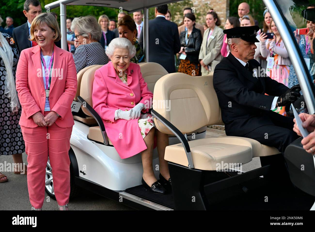 Britain's Queen Elizabeth II sits in a buggy during a visit by members ...
