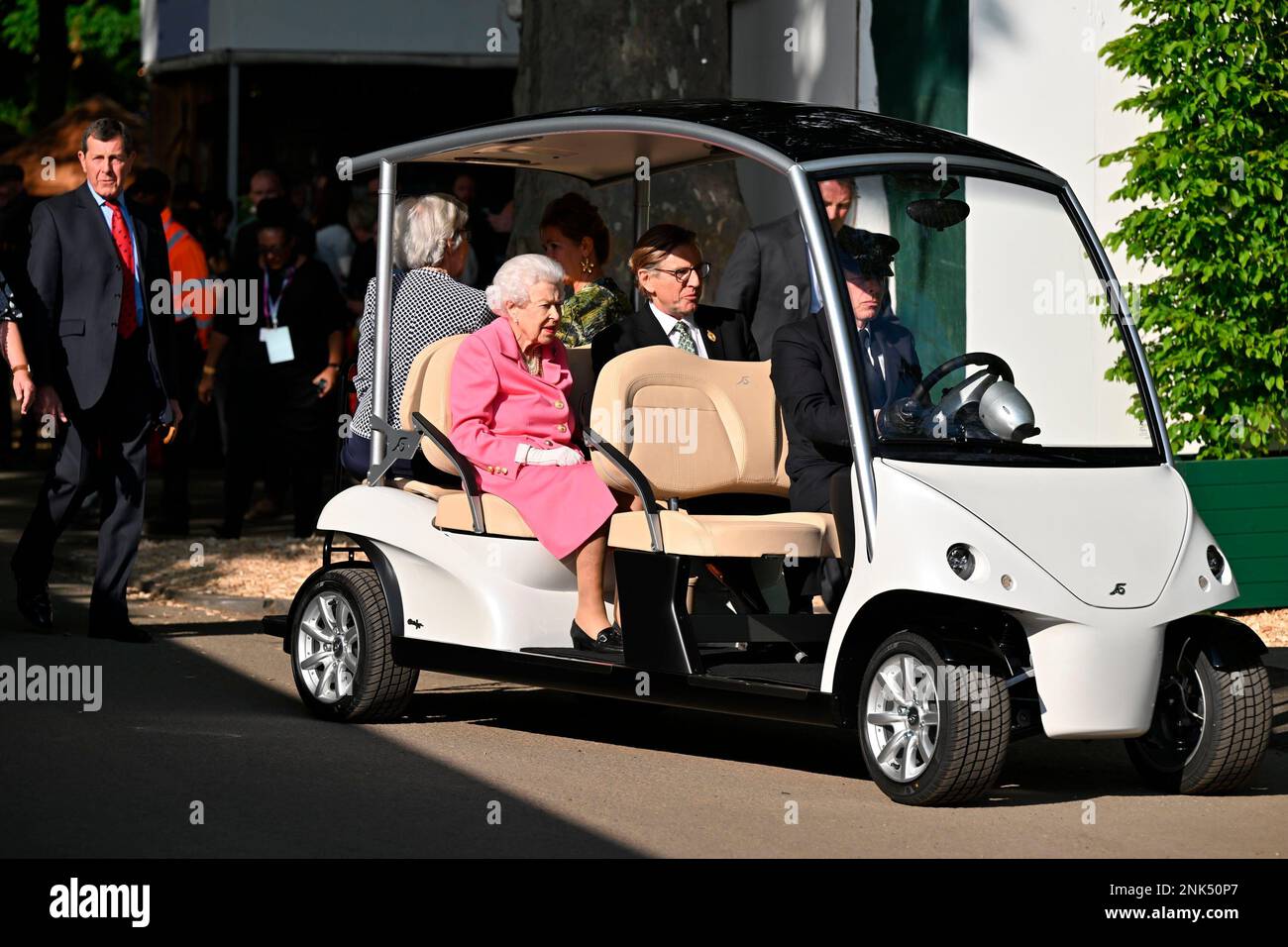 Britain's Queen Elizabeth II sits in a buggy during a visit by members ...